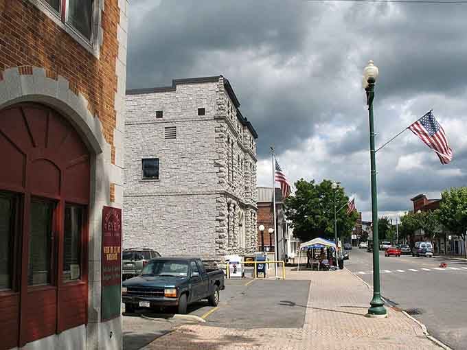 Storm clouds gather dramatically over this peaceful street, adding free theater to your afternoon walk through town.