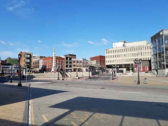The plaza opens up like a town square from another era, where monuments and benches invite you to linger awhile.
