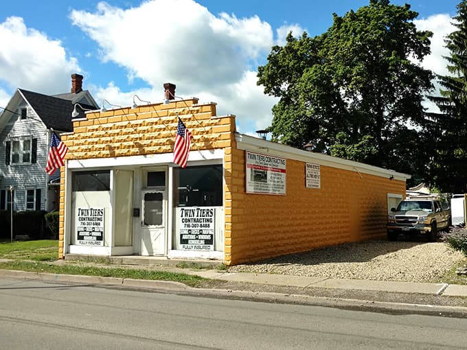 Twin American flags frame this charming little building that proves good things really do come in small packages.