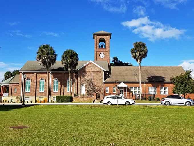 That clock tower rises above the green like a reminder that time moves differently in small towns.