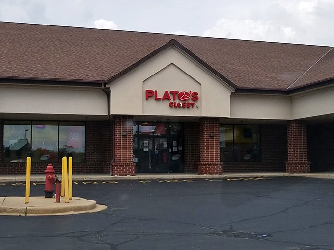 The welcoming storefront of Plato's Closet in Pleasant Prairie, where fashion treasures await behind those brick-framed doors.