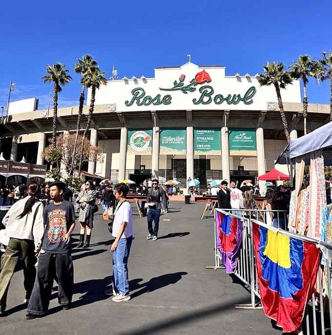 The iconic Rose Bowl stadium towers majestically behind palm trees, creating a legendary backdrop for serious vintage hunting.