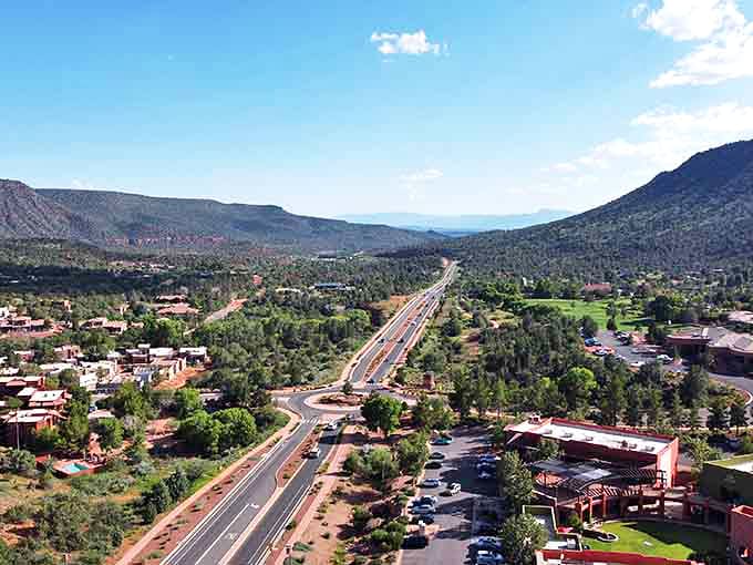 Sedona's highway stretches like a welcome mat, inviting you to explore the red rock wonderland beyond.