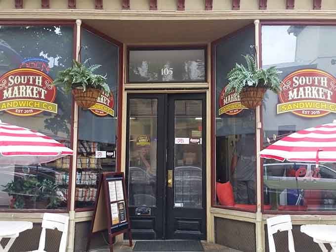 Historic downtown charm meets modern sandwich artistry behind these cheerful striped umbrellas and welcoming double doors right here.