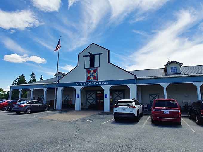 This charming barn-style building with its colorful quilt square looks like something straight out of a Hallmark movie scene.