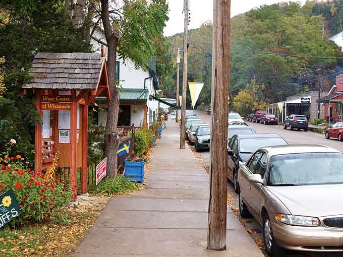 A charming welcome kiosk surrounded by flowers greets visitors with small-town hospitality you can actually feel.