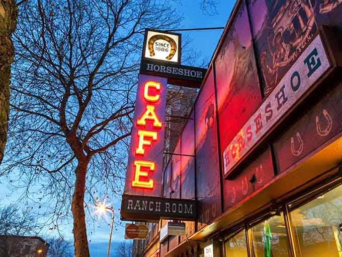 That towering vertical "CAFE" sign glows like a Broadway marquee, announcing breakfast stardom in every golden letter.