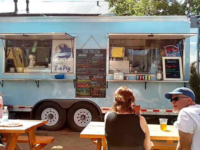 The Tin Pig's food truck looks like it was painted the exact color of a perfect summer sky.