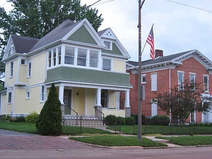 Painted Victorian homes stand proud with their iron fences, showing off colors that would make HGTV hosts weep with joy.