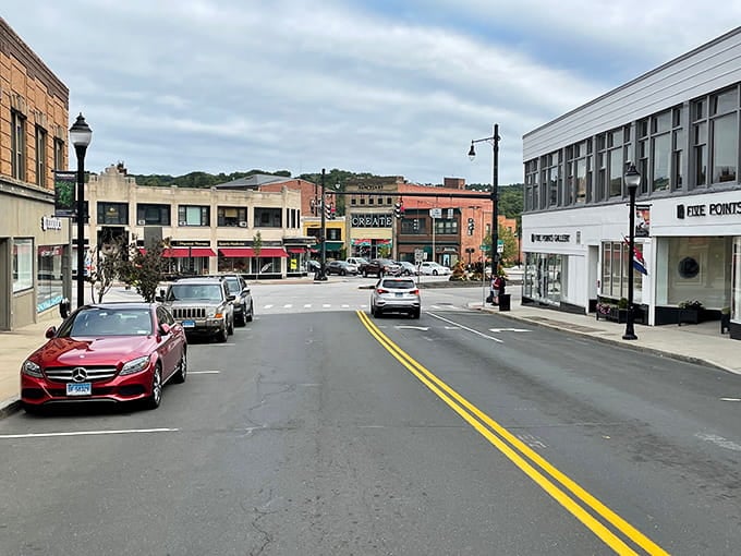 Main street architecture blends eras seamlessly, from Victorian storefronts to modern shops sharing the same sidewalk.