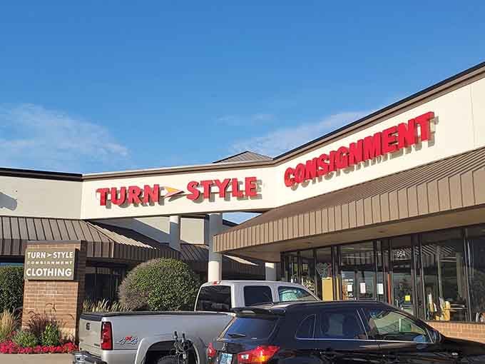 The curved storefront design and manicured landscaping give this consignment shop an upscale feel that matches its curated selection.