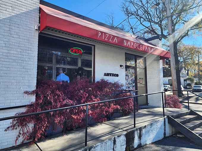 The red awning and white brick &ndash; simple, classic, and unpretentious, just like their perfect Margherita.