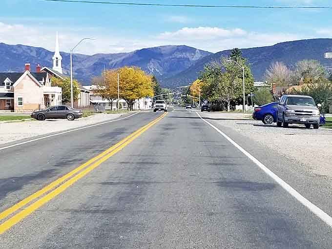 Mountains rise toward the town like natural guardians, watching over a community where costs stay refreshingly low.