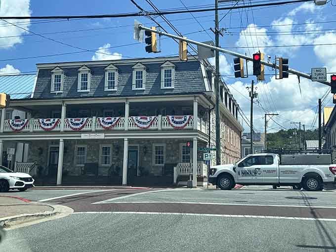 That distinguished colonial building wears its bunting like Sunday best, honoring heroes while anchoring the community with grace.