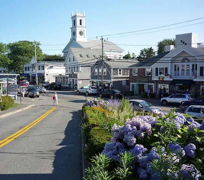 Purple hydrangeas frame the iconic white steeple, proving Mother Nature knows exactly what she's doing with color coordination.