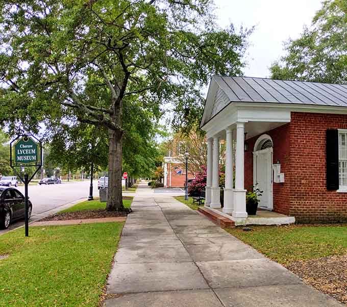 White columns and brick charm create the kind of museum entrance that makes history feel welcoming, not stuffy.