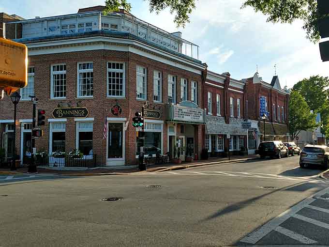 Evening light softens historic facades where community theater marquees promise entertainment without the big-city ticket prices.