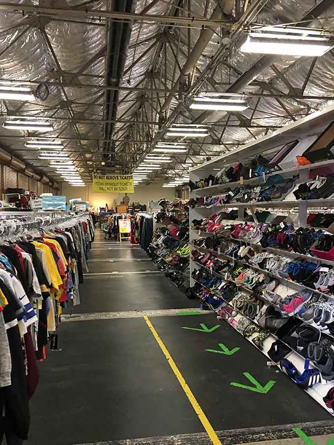 Those towering shoe racks stretch toward the ceiling like a footwear lover's stairway to heaven, organized and ready.