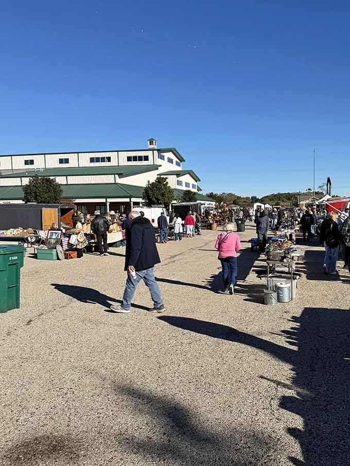 The main building towers over outdoor vendors, creating a treasure-hunting campus where you could easily spend an entire Saturday.
