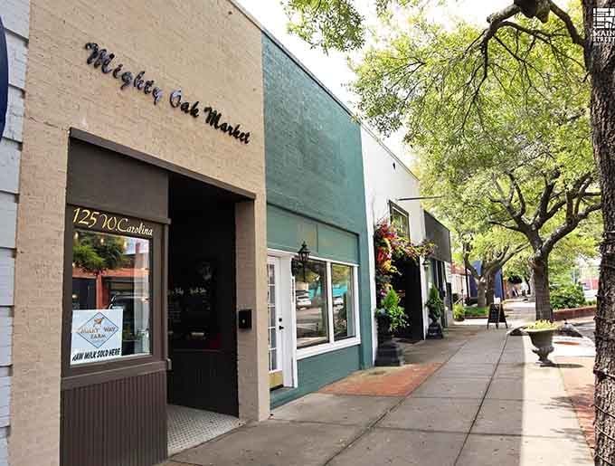 Shaded sidewalks invite leisurely strolls past shops that have served generations, not just quarterly earnings reports.