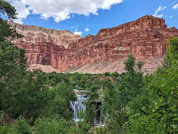 The layered canyon walls frame this masterpiece like nature's own art gallery exhibition space.
