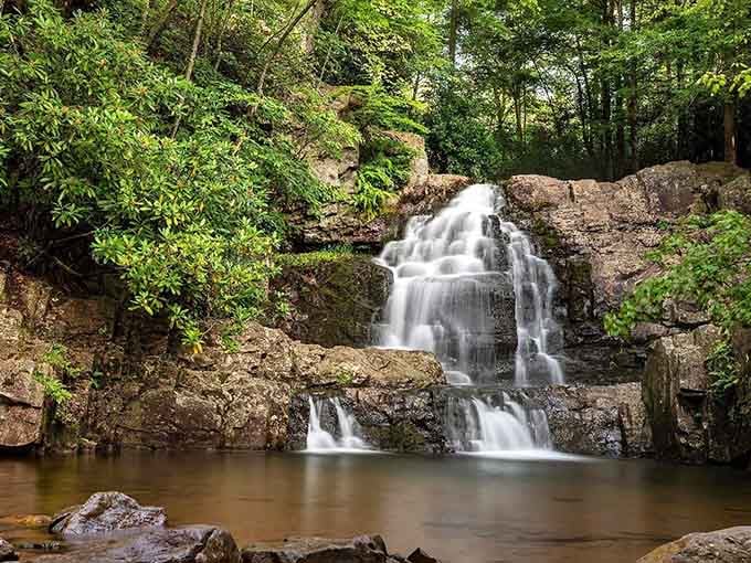 This intimate waterfall setting feels like discovering a secret garden, complete with ancient rocks and dappled forest light.