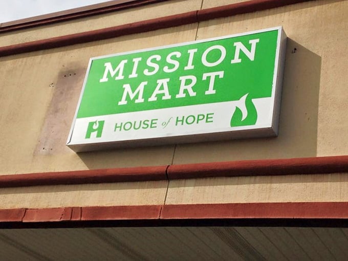 That fresh green sign against brick tells you something special waits inside this generous space.