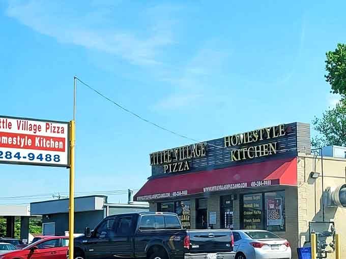 The straightforward signage and red awning of Little Village Pizza promise honest, delicious food without pretension. Sometimes simple is best!