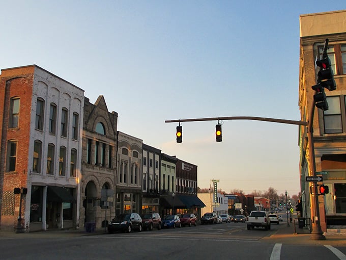 Sunset paints the brick facades in warm light as the day winds down on this timeless main street.