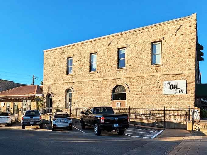 The Owl Cafe's vintage sign stands out like a landmark, marking this corner as a gathering spot for locals.