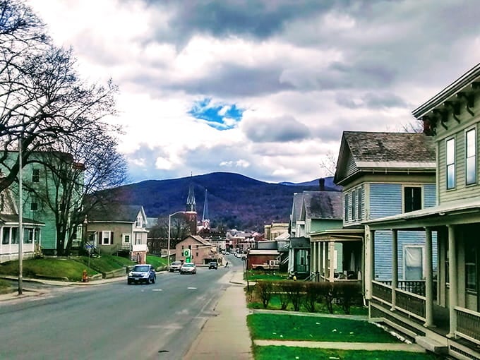 Mountains frame residential streets where front porches still mean something to the people who sit there.