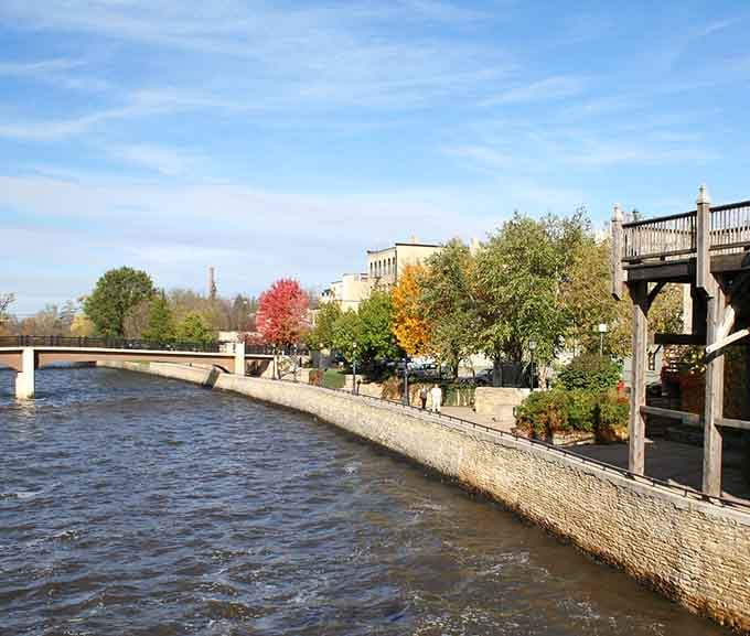 Autumn colors splash across the riverfront like nature decided to show off just for your visit today.