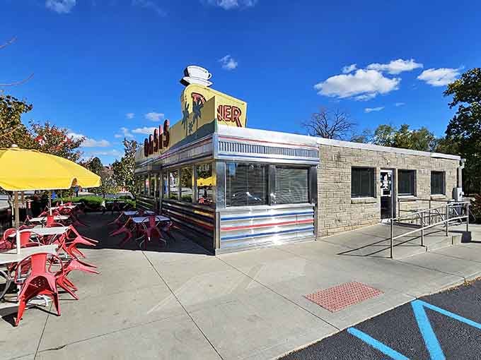 The retro coffee cup perched on top is like a lighthouse guiding hungry travelers to safety.