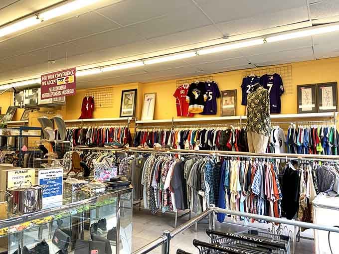 Sports jerseys line the upper walls like a hall of fame, while everyday clothes fill the racks below.