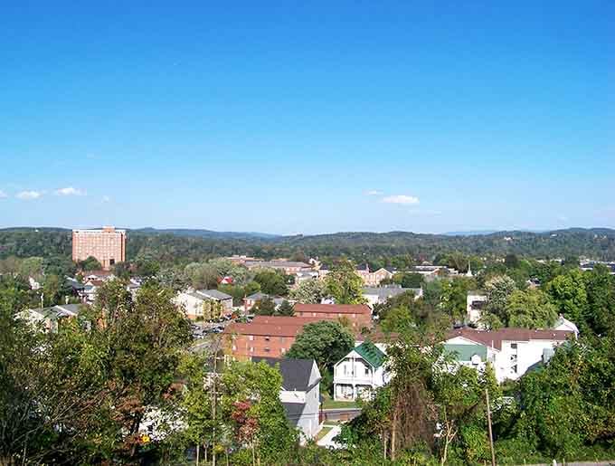 Rolling hills cradle the town like nature's own recliner, offering views that cost absolutely nothing extra.