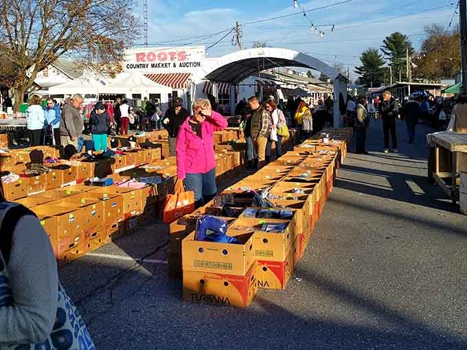 Those produce crates lined up like soldiers hold tomorrow's auction items, ready for eager bidders to discover.
