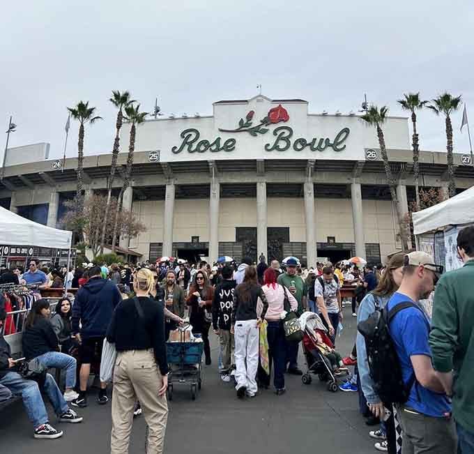 Massive crowds gather beneath the famous venue where football history meets flea market culture in perfect harmony.