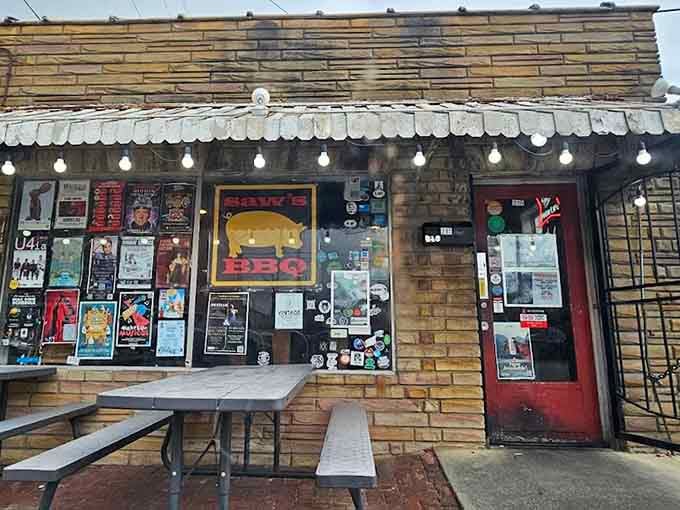The eclectic decorations and string lights create the perfect backdrop for serious barbecue served with a smile.