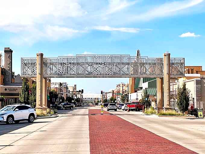 Salina's artistic pedestrian bridge spans more than just a street. It's like a silver ribbon connecting affordable living to small-town charm.