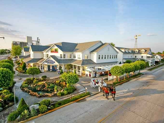 Golden hour bathes this sprawling complex where carefully tended gardens and white carriage horses create an unforgettable pastoral scene.
