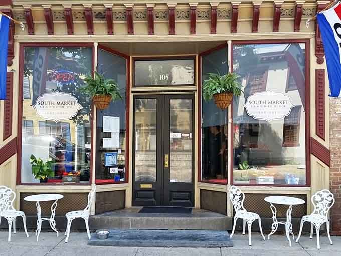 The ornate brickwork and hanging flower baskets frame an entrance that promises sandwiches made with old-fashioned attention to detail.