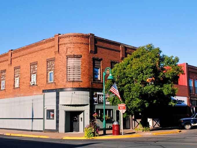 That corner building's brick facade has witnessed generations of stories, standing strong through every Wisconsin winter imaginable.