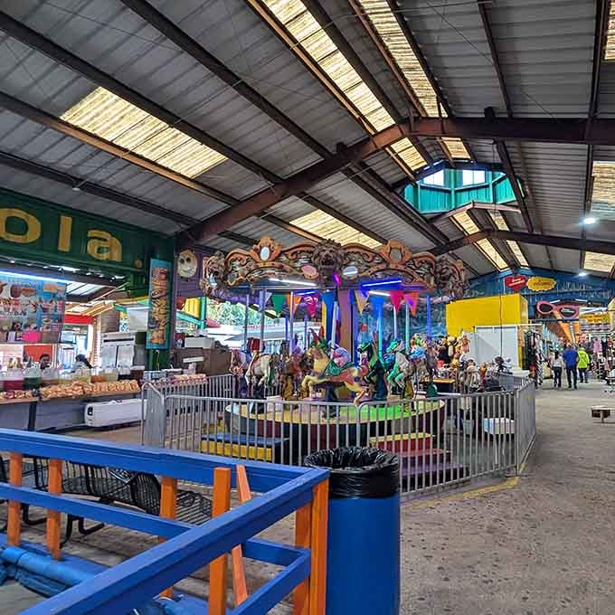 That carousel spins under metal rafters while families shop, combining childhood nostalgia with serious bargain hunting.
