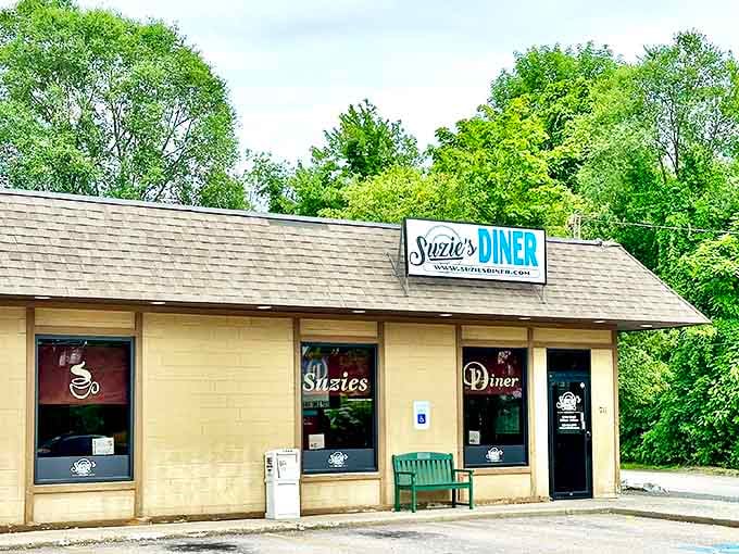 Nestled among trees with its unassuming charm, Suzie's Diner stands ready to serve comfort food that speaks louder than any flashy billboard ever could.