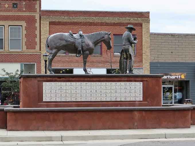 This bronze cowboy statue in Thermopolis stands sentinel over downtown, a silent tribute to Wyoming's enduring ranching heritage.