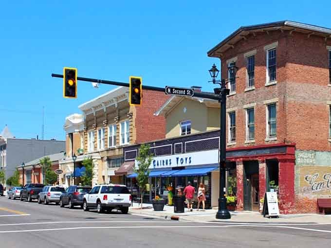 Old meets new where historic brick buildings share the street with modern architecture, creating an interesting visual conversation.