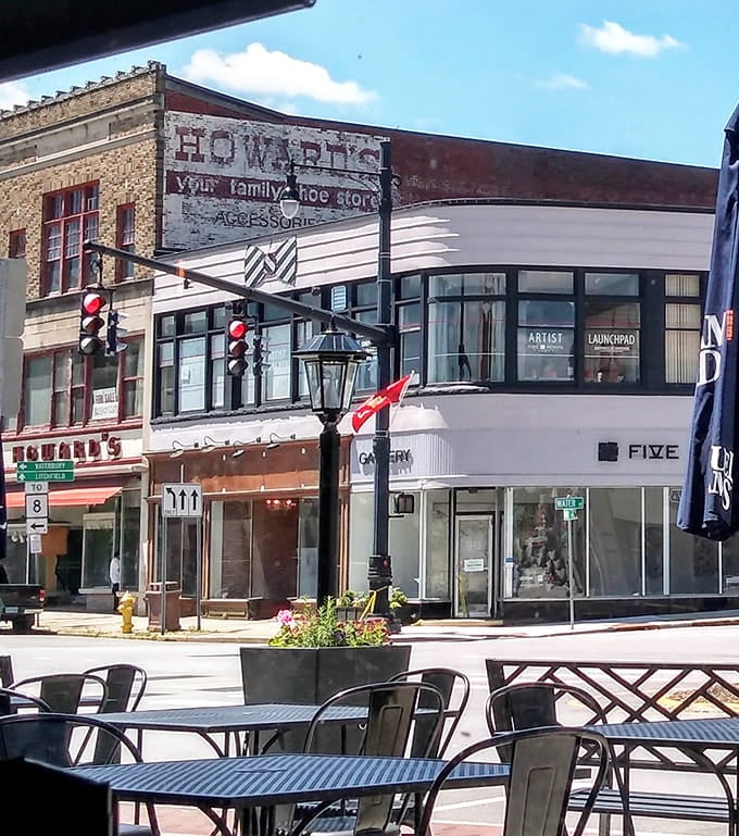 Ghost signs whisper stories of old family businesses while outdoor tables invite you to slow down and people-watch.