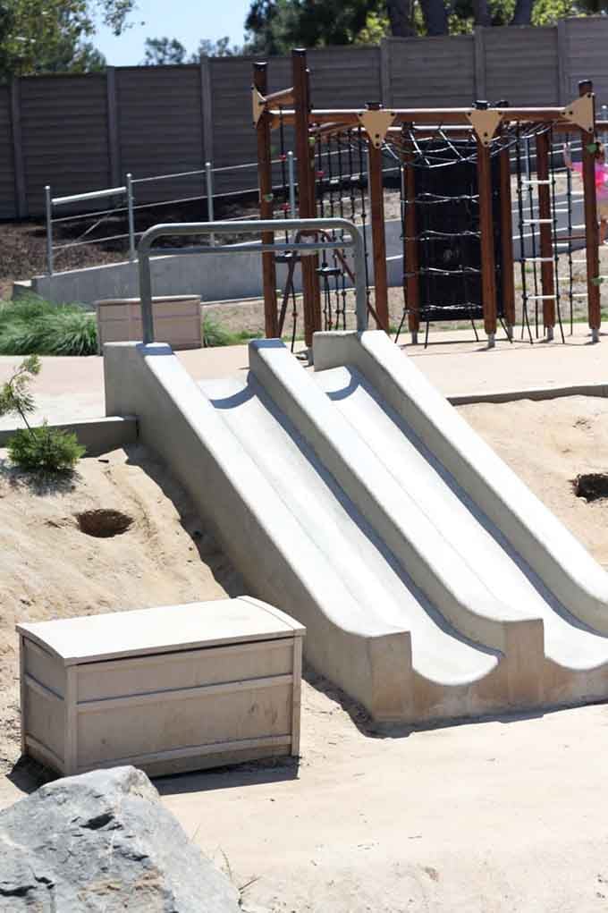 Three concrete slides side by side mean racing your siblings is mandatory, and bragging rights last until next visit.