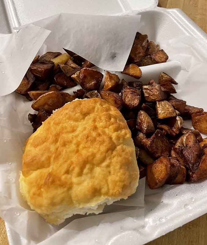A biscuit the size of your fist paired with home fries means someone here understands portion control is overrated.