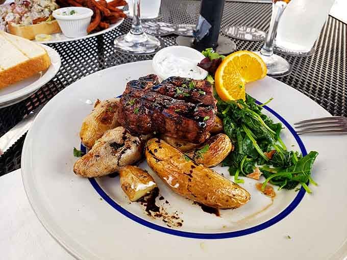 That steak sits atop roasted potatoes like a crown, proving gothic taverns know their way around protein.